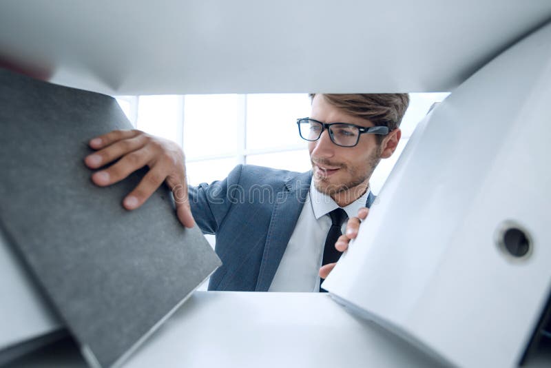 Smiling Man Looking at Documents Stock Image - Image of glasses ...
