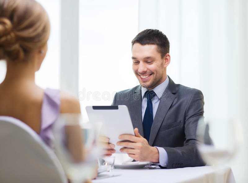 Smiling Man Looking at Menu on Tablet Pc Computer Stock Photo - Image ...