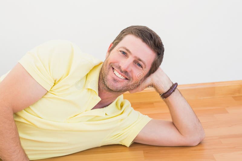 Smiling Man Lying on the Floor at Home Stock Image - Image of adult ...