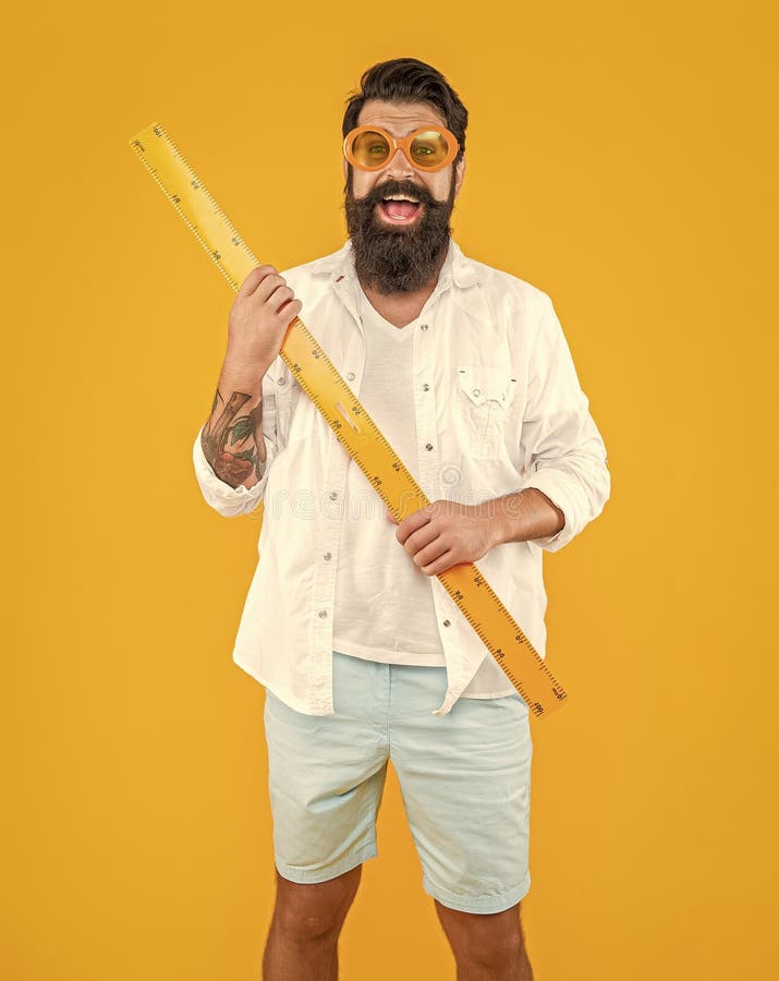 Smiling Man with Measuring Ruler Isolated on Yellow. Man with Measuring ...