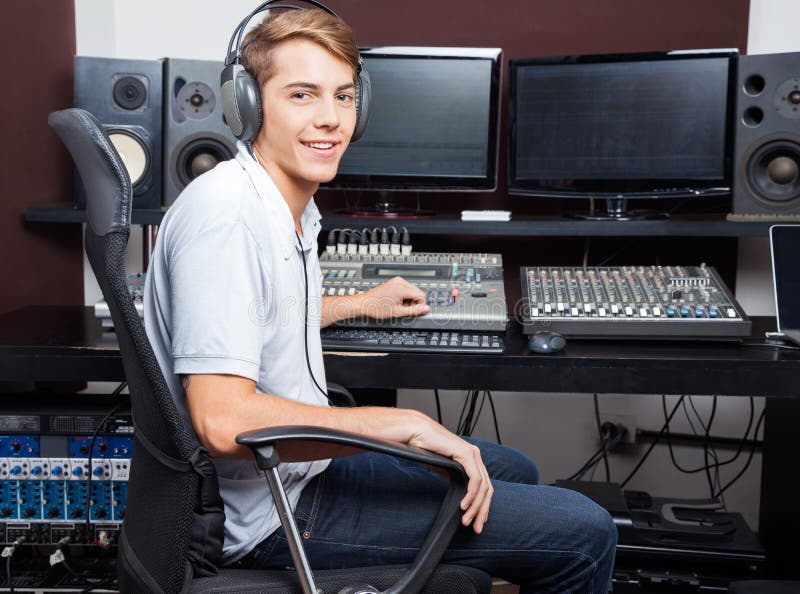 Smiling Man Mixing Audio in Recording Studio Stock Photo - Image of ...
