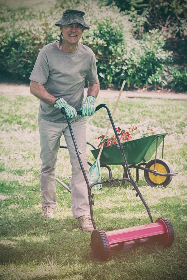 Man with Lawnmower on Grass Stock Photo - Image of mower, push: 92993374