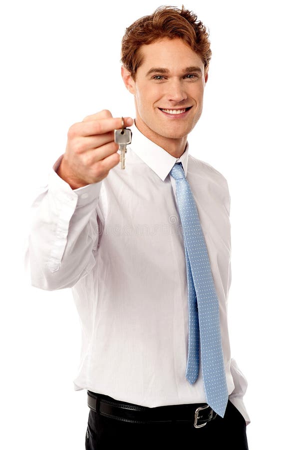 Smiling Man Offering House Key Stock Photo - Image of cheerful, open ...