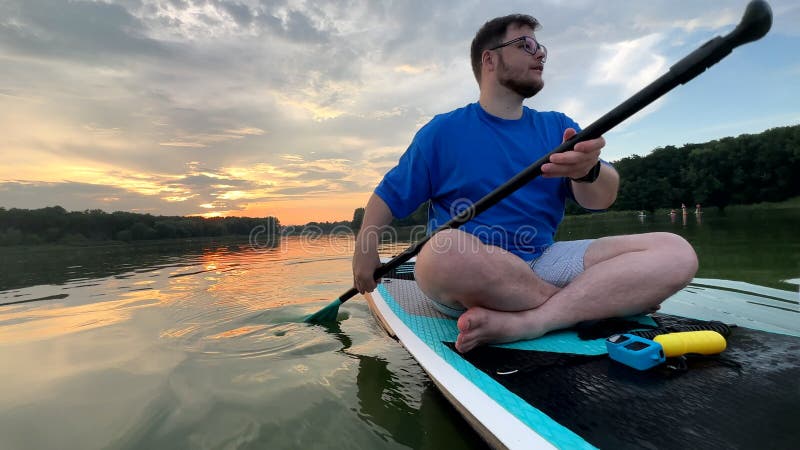 Man Paddling on Supboard on Sunset Stock Video - Video of leisure ...