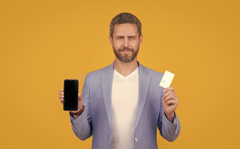 Smiling Man Paying Ecommerce Online Isolated on Yellow. Man Paying ...