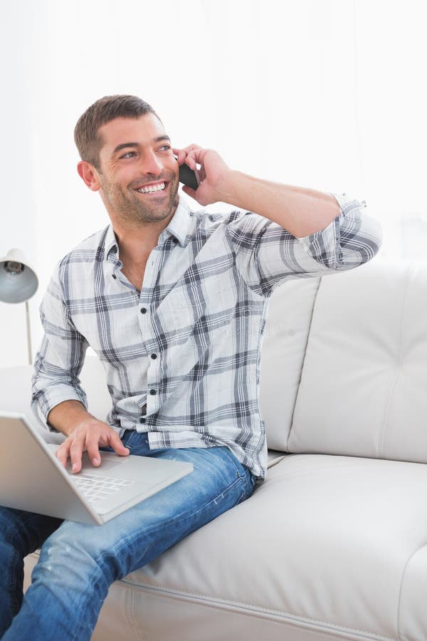 Man Talking On Phone Using Computer Stock Photo - Image of goodlooking ...