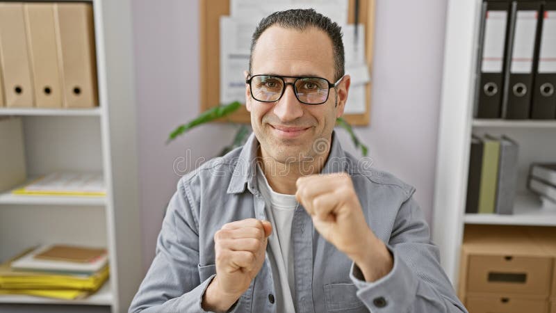A Smiling Man Poses Confidently in a Modern Office, Conveying Optimism ...