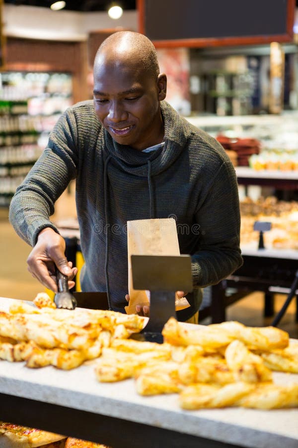 Smiling Man Purchasing Bread Stock Image - Image of holding, buying ...