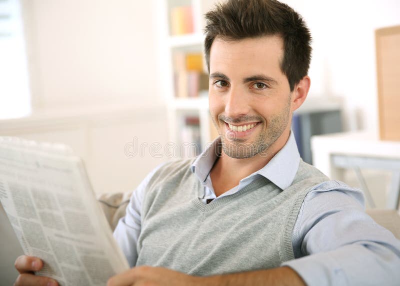 Smiling man reading news stock photo. Image of smile - 31523334