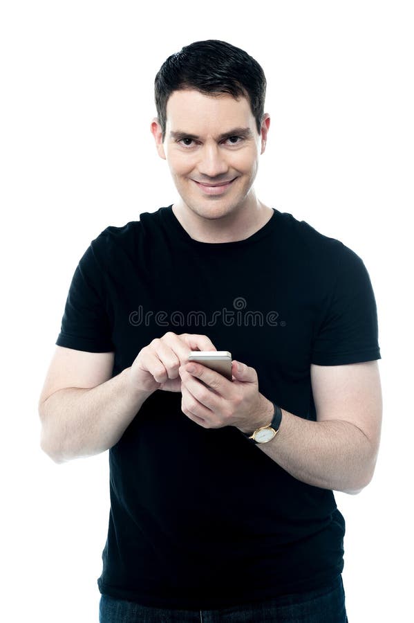 Smiling Man Reading Text Message on Smart Phone Stock Photo - Image of ...