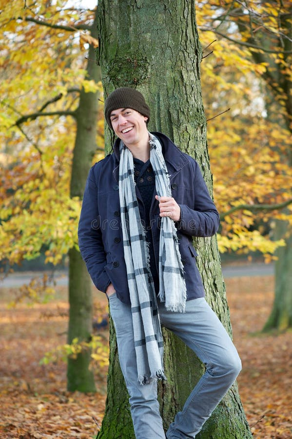 Smiling Man Relaxing Outdoors on a Fall Day Stock Image - Image of ...