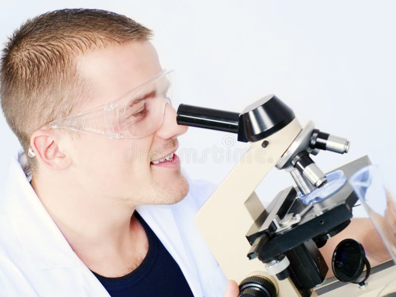 Smiling Man Researching on a Microscope Stock Photo - Image of hospital ...