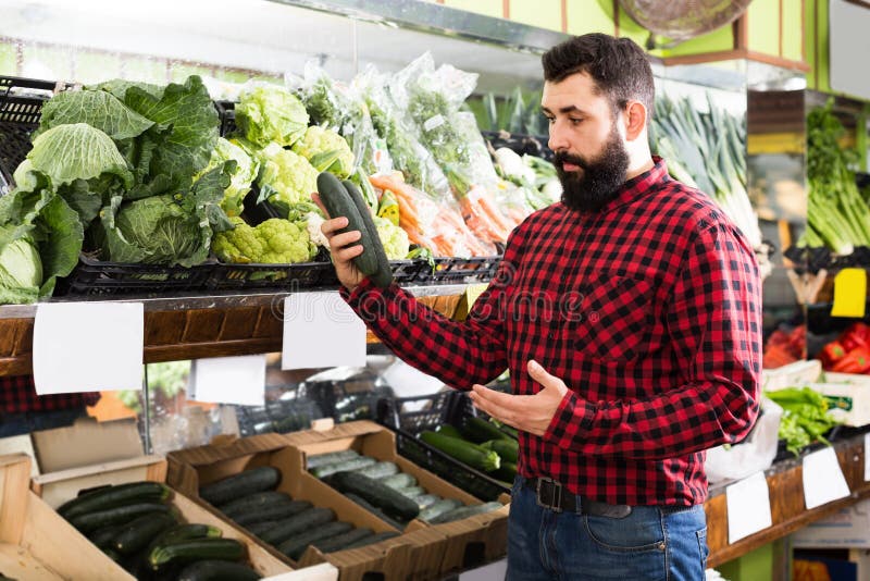 Smiling Man Seller Showing Cucumbers in Shop Stock Image - Image of ... Smiling Man Seller Showing Cucumbers in Shop Stock Image - Image of ...