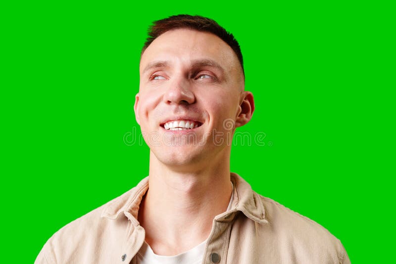 Smiling Man with Short Hair Posing Against Bright Green Backdrop Stock ...