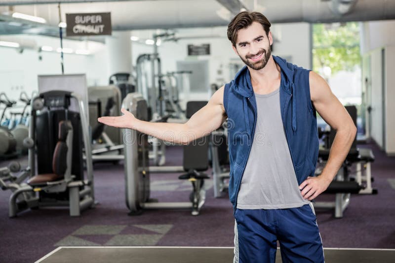 Smiling Man Showing the Gym Stock Photo - Image of sport, presenting ...