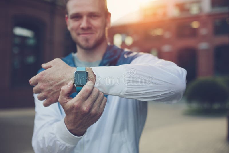 Smiling Man Showing His Smart Watches on the Wrist Stock Photo - Image ...