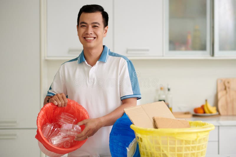 Smiling Man Sorting Waste stock image. Image of household - 312764725