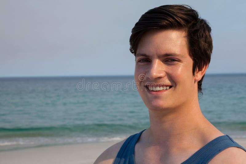 Smiling Man Standing at Beach on a Sunny Day Stock Image - Image of ...