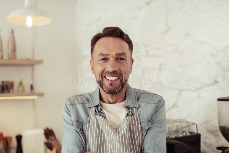 Smiling Man Standing in the Kitchen Alone. Stock Photo - Image of ...