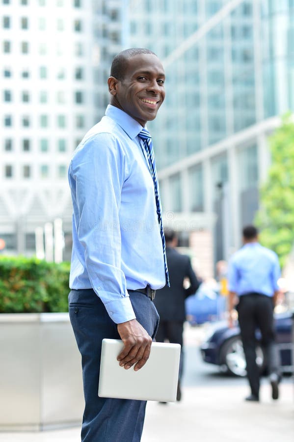 Smiling Man Standing Outside Offices Building Stock Image - Image of ...