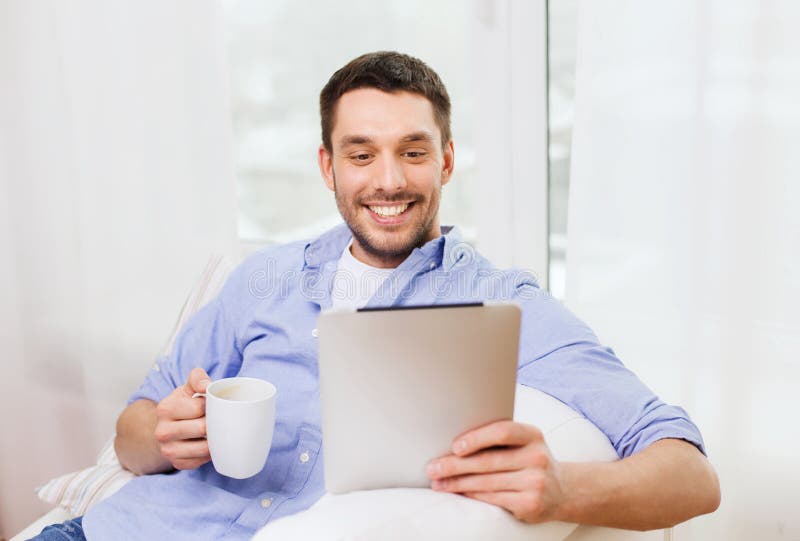Smiling Man with Tablet Pc and Cup at Home Stock Image - Image of ...