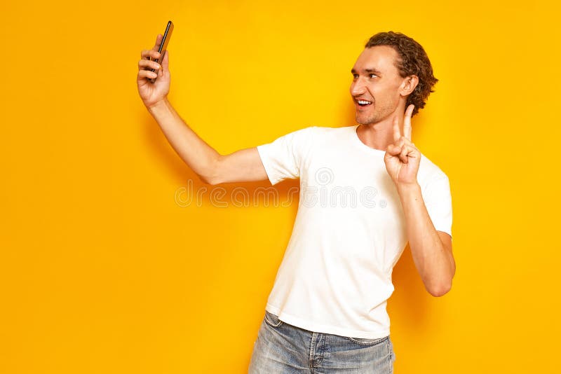 4 908 Young Man Smiling Showing Hand Peace Sign Photos Free And Royalty