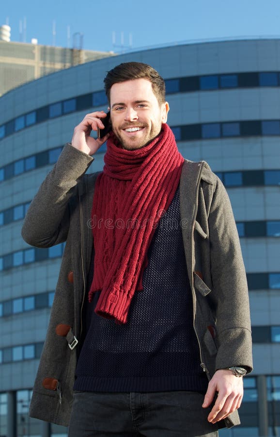 Smiling Man Talking on Mobile Phone Outside Building Stock Image ...