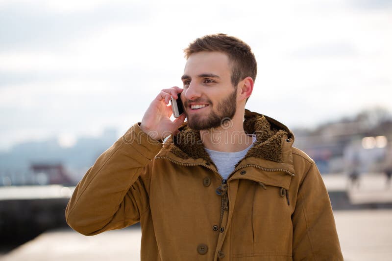 Smiling Man Talking on the Phone Outdoors Stock Image - Image of phone ...