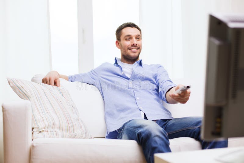 Smiling Man with Tv Remote Control at Home Stock Photo - Image of male ...