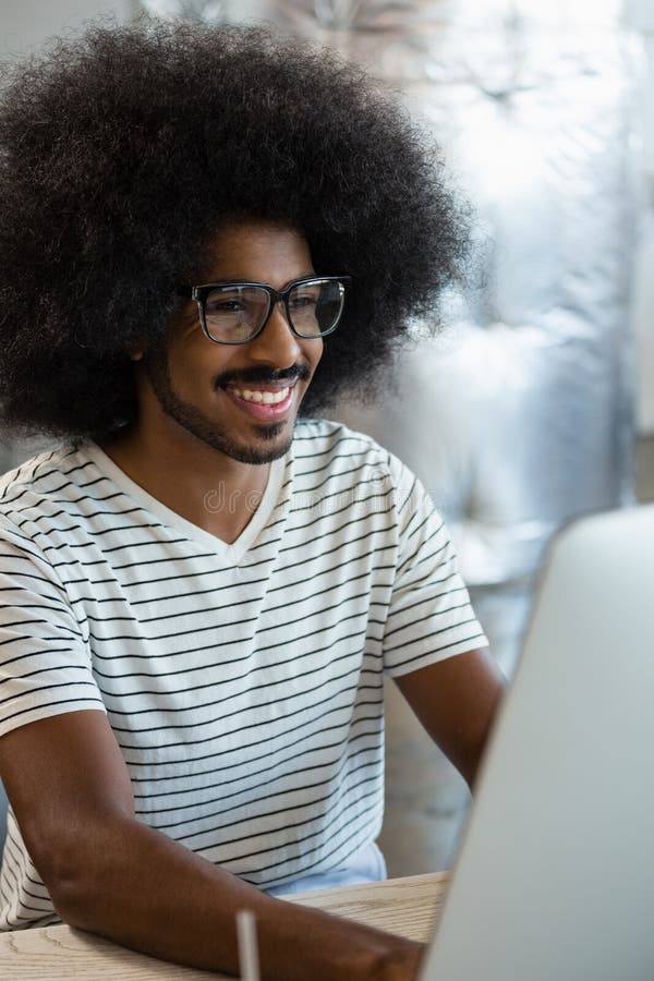 Smiling Man Using Computer at Office Stock Photo - Image of occupation ...