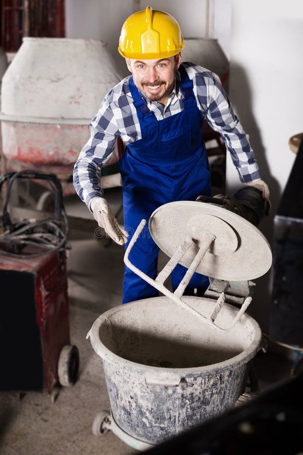 Smiling Man Using Concrete Mixer for Construction Work Stock Image ...