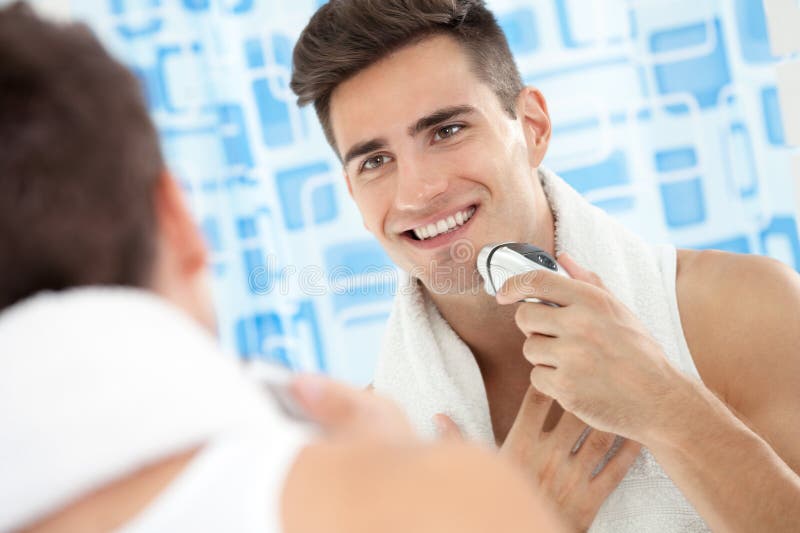 Smiling Man Using Electric Shaver Stock Photo - Image of naked ...