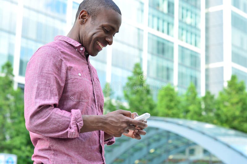 African Man Using His Mobile Phone Stock Photo - Image of middle, male ...