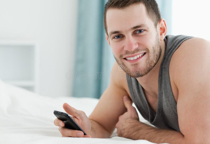 Smiling Man Using His Mobile Phone Stock Photo - Image of phone, person ...
