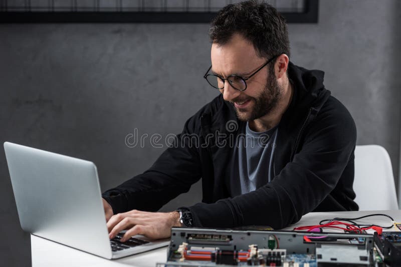 Smiling Man Using Laptop Against Broken Pc Stock Image - Image of ...
