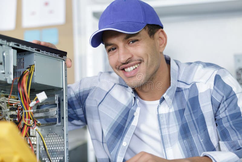 Smiling Man Using Multimeter while Fixing Pc Stock Photo - Image of ...