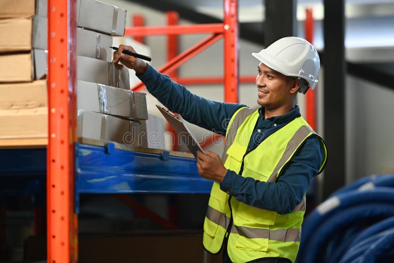 Smiling Man Warehouse Workers with Safety Hard Hat and Vest Checking ...