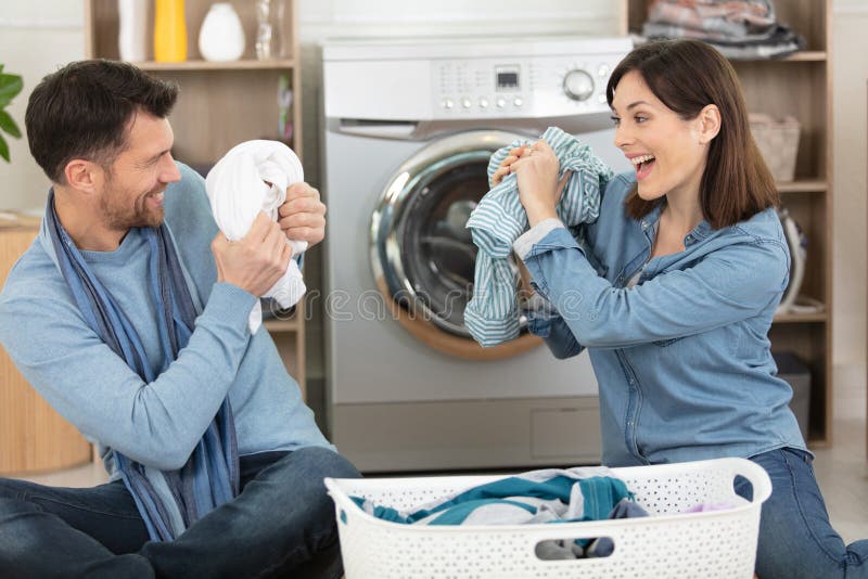 Smiling Man and Woman Having Fun at Laundry Stock Image - Image of ...
