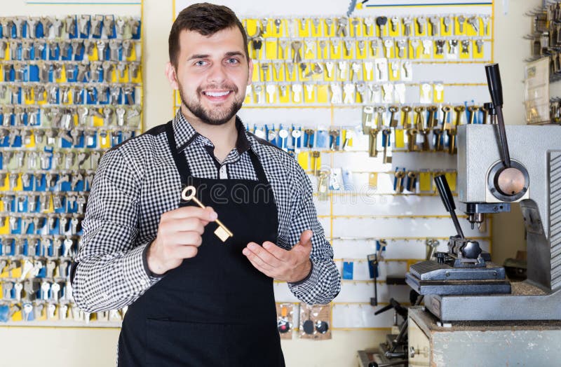 Smiling Man Worker Showing Key in Workshop Stock Photo - Image of ...
