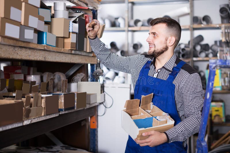 Smiling Man Worker Sorting Sanitary Engineering Details Stock Photo ...