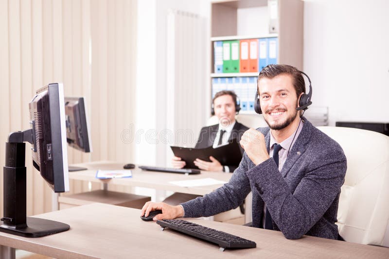 Smiling Man Working at Customer Service Support in the Office Stock ...