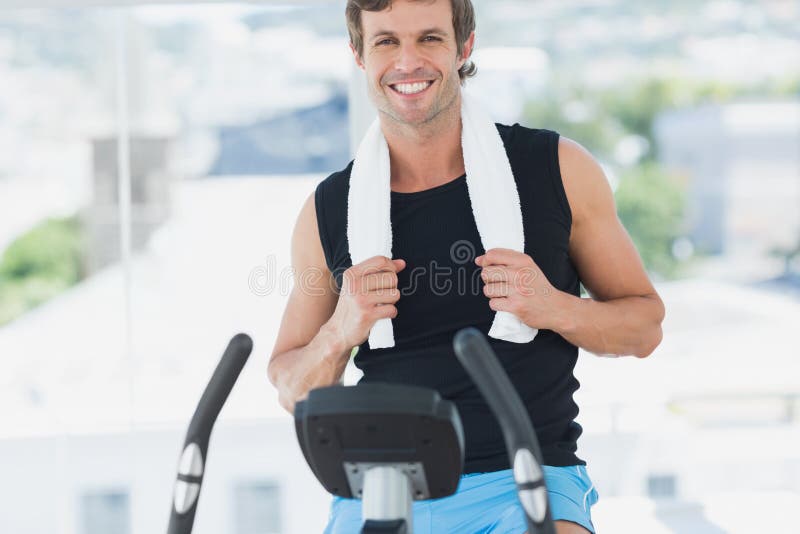 Smiling Man Working Out at Spinning Class in Bright Gym Stock Image ...