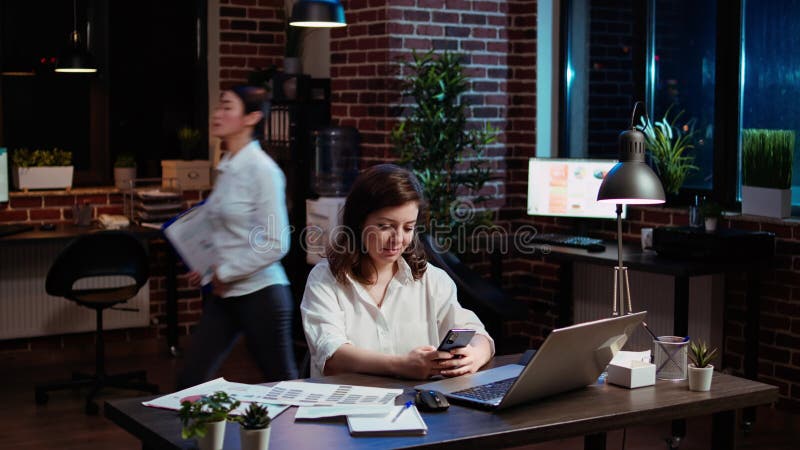 Smiling Manager Looking at Text Messages on Smartphone, Taking Break ...