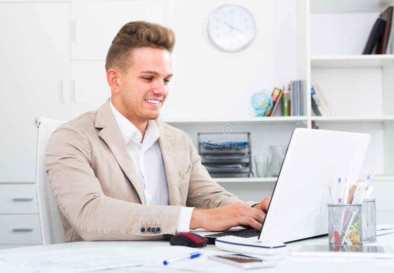 Smiling Manager at Office Desk with Laptop Stock Image - Image of ...
