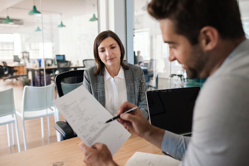 Smiling Manager Interviewing an Applicant in His Office Stock Photo ...