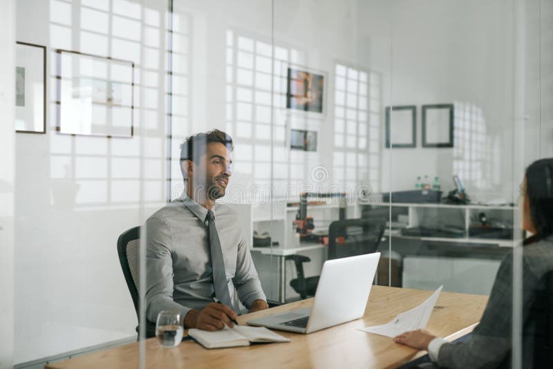 Smiling Manager Talking with a Job Applicant in His Office Stock Photo ...
