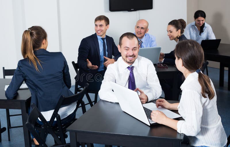 Smiling Managers Having a Productive Day in Office Stock Photo - Image ...