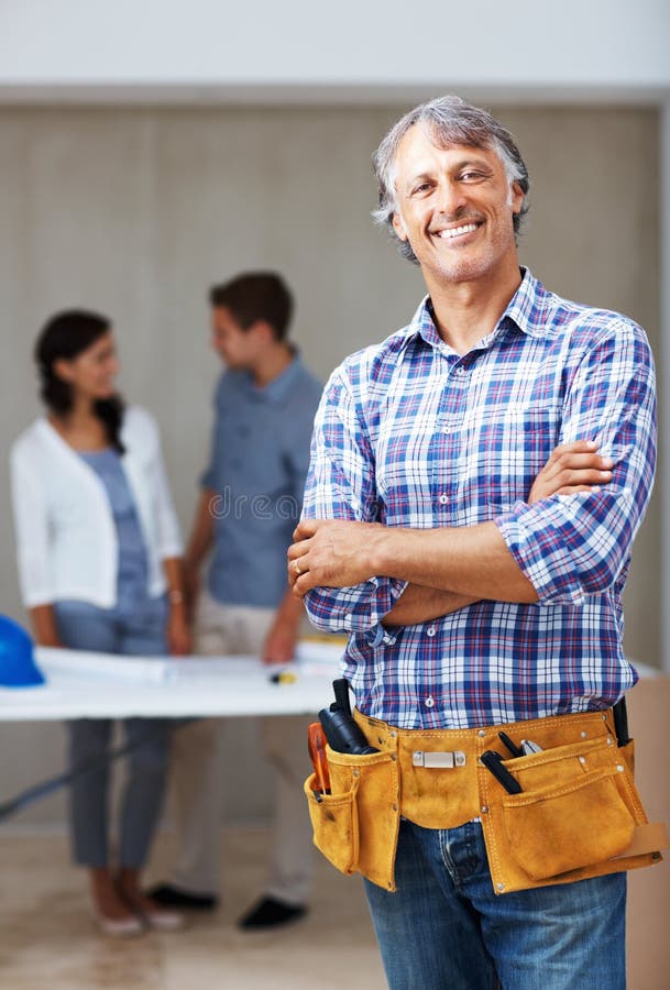 Smiling Mature Architect with Clients in Background. Portrait of Mature ... Smiling Mature Architect with Clients in Background. Portrait of Mature ...