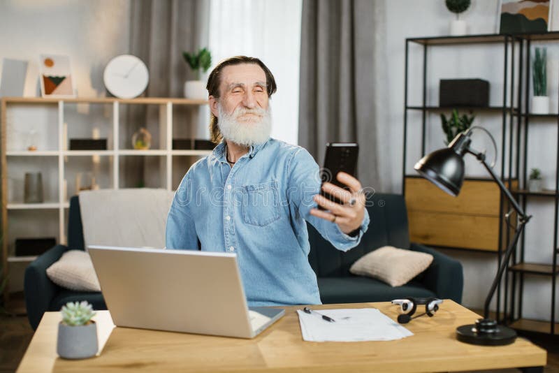 Smiling Mature Businessman Using Modern Smartphone Making Selfie Photos ... Smiling Mature Businessman Using Modern Smartphone Making Selfie Photos ...