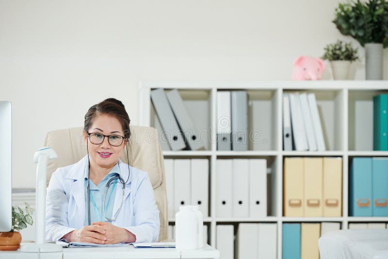 Smiling Mature General Practitioner Stock Image - Image of hospital ...